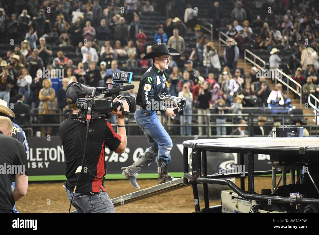 Professional Bull Rider Jose Vitor Leme is presented a trophy after ...