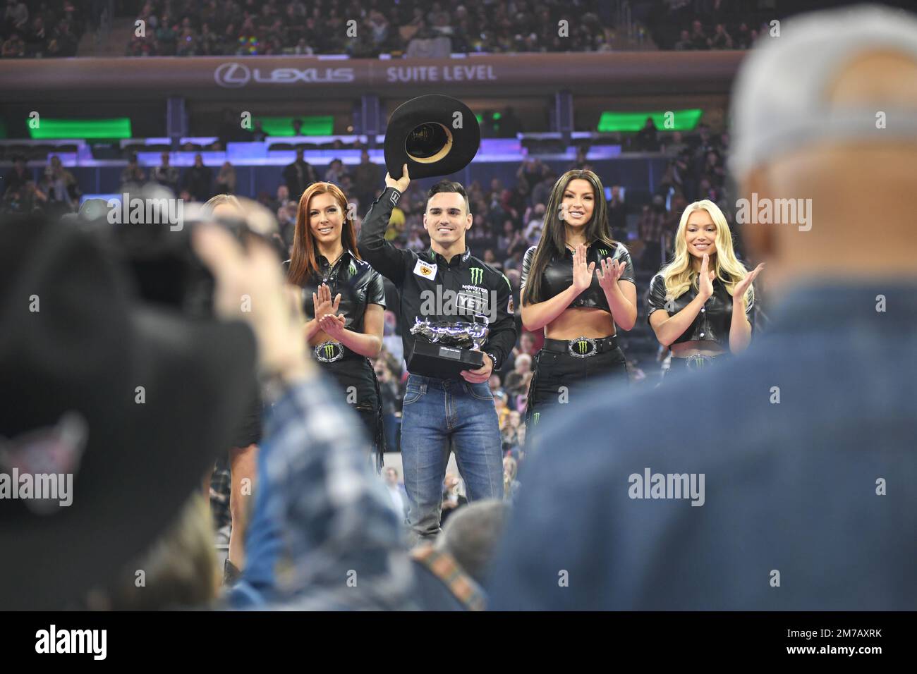 Professional Bull Rider Jose Vitor Leme is presented a trophy after ...