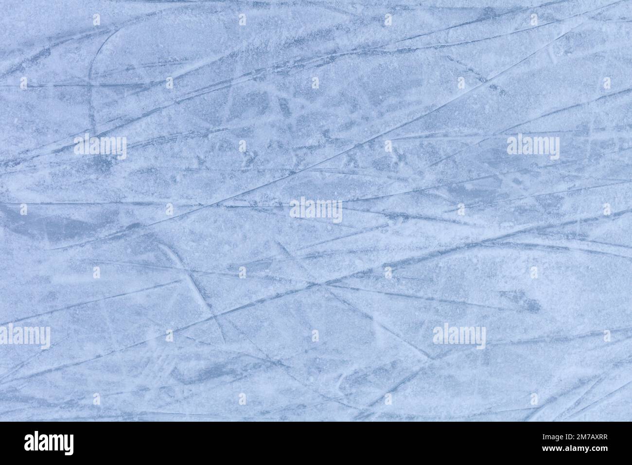 Empty ice rink with skate marks after the session outdoor. skating ice ...