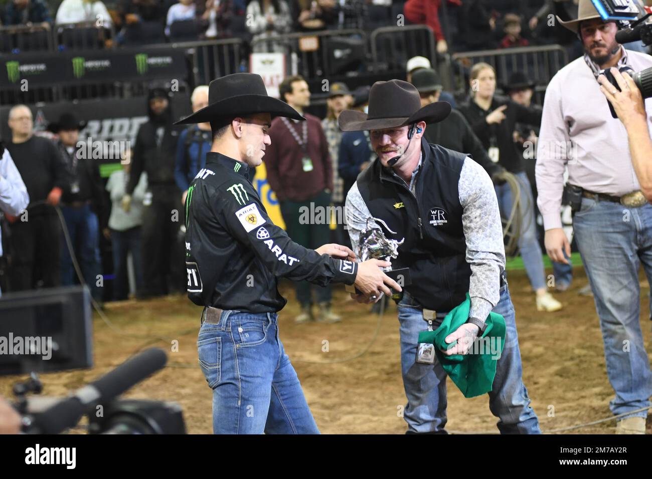 Professional Bull Rider Jose Vitor Leme is presented a trophy after ...