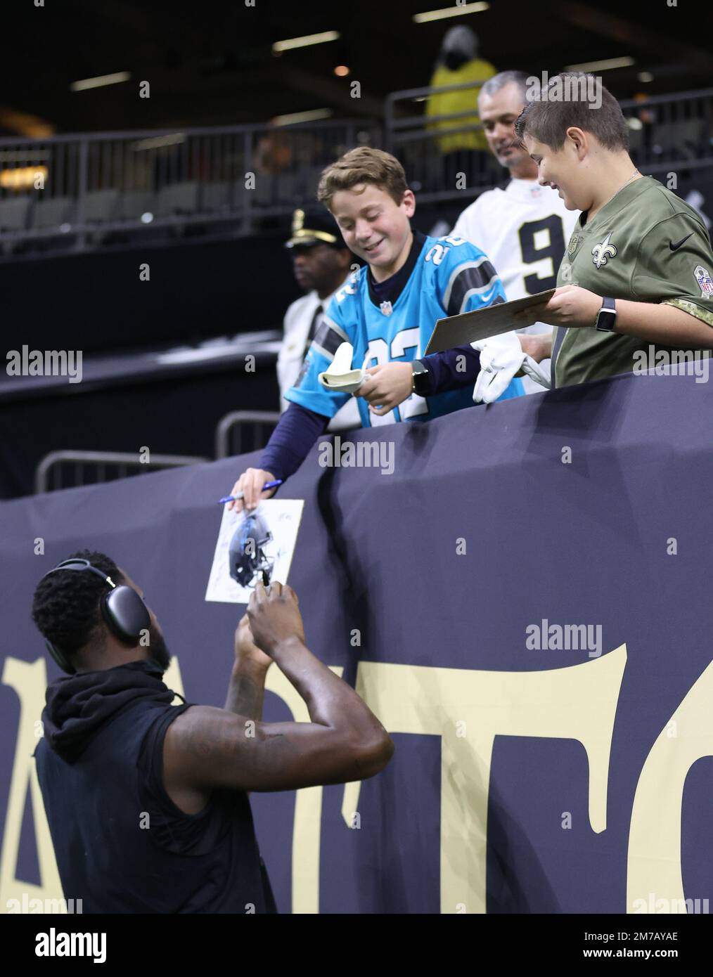 A young Carolina Panthers fans gets an autograph from a Panthers ...