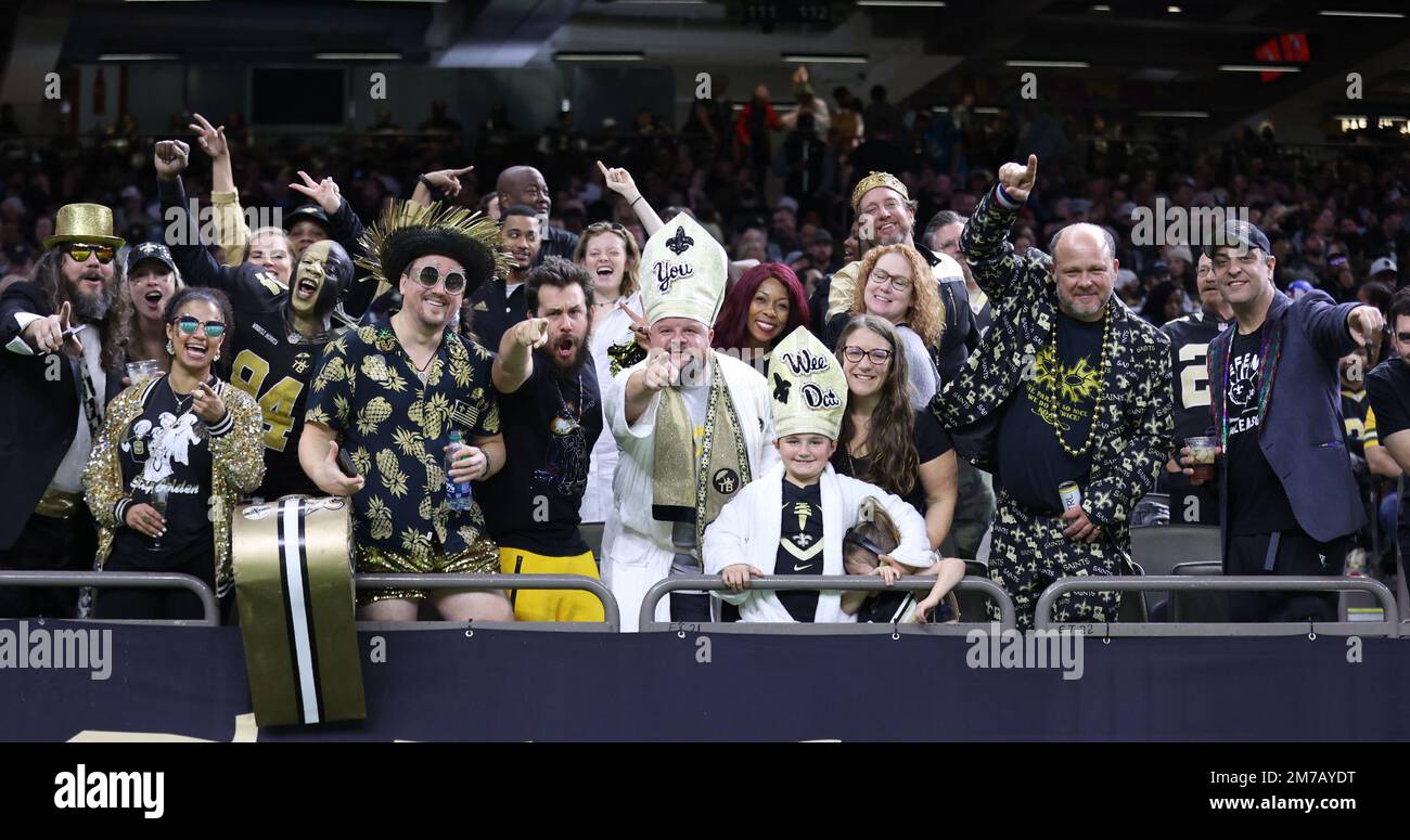 A group of costumed New Orleans Saints fans all pose for a photo during ...