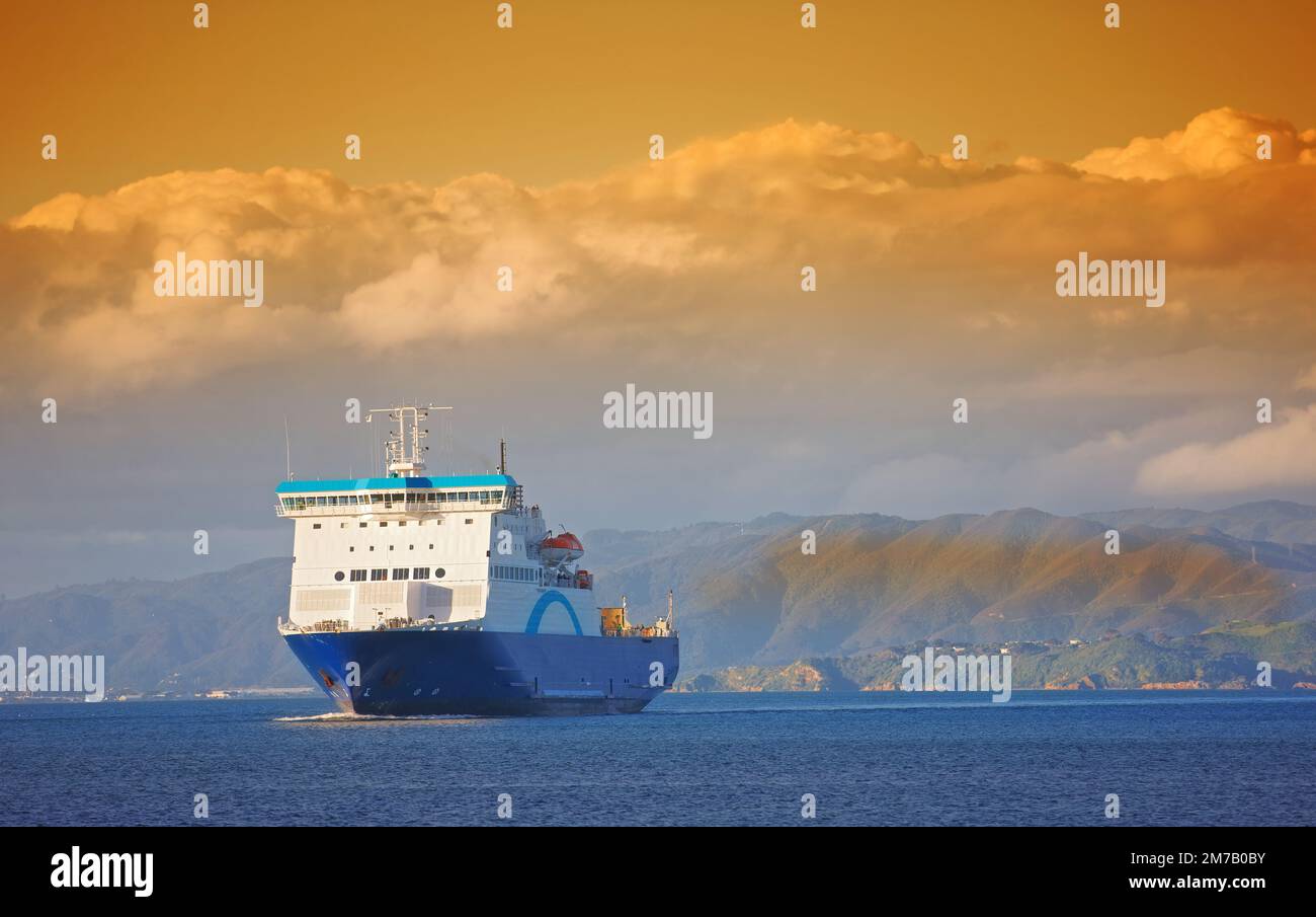 Cargo ship sailing sunset hi-res stock photography and images - Alamy