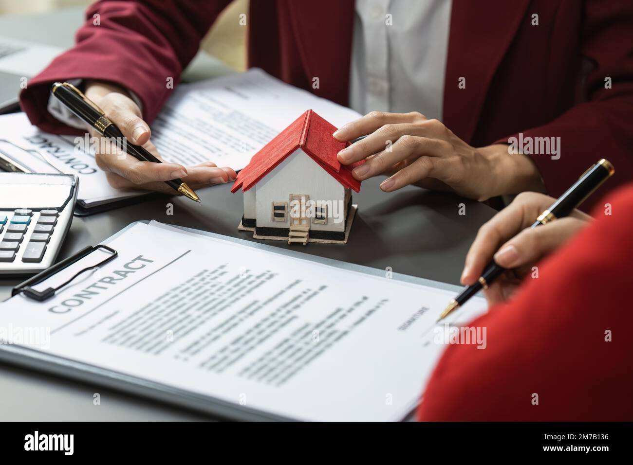 Real Estate Agent explain insurance and agreement contract to client ... Real Estate Agent explain insurance and agreement contract to client ...