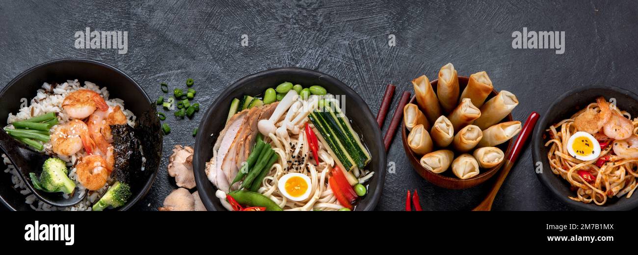 Traditional Asian food. Various of asian meals on dark background ...