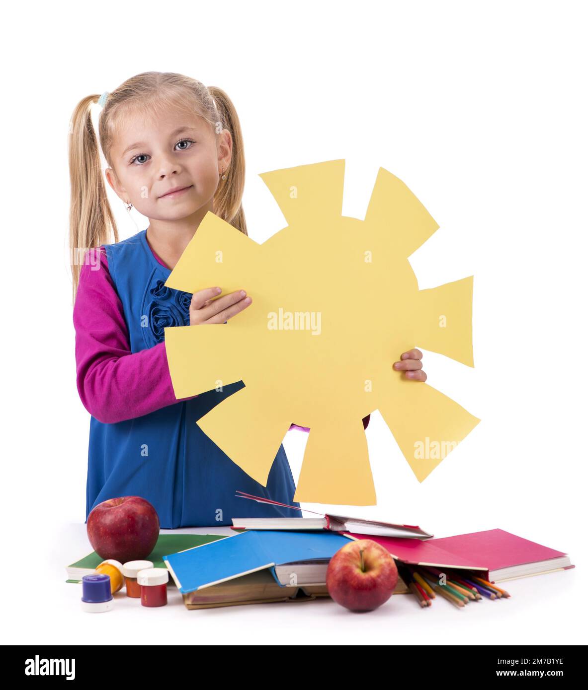 Happy cheerful child drawing with brush in album using a lot of ...