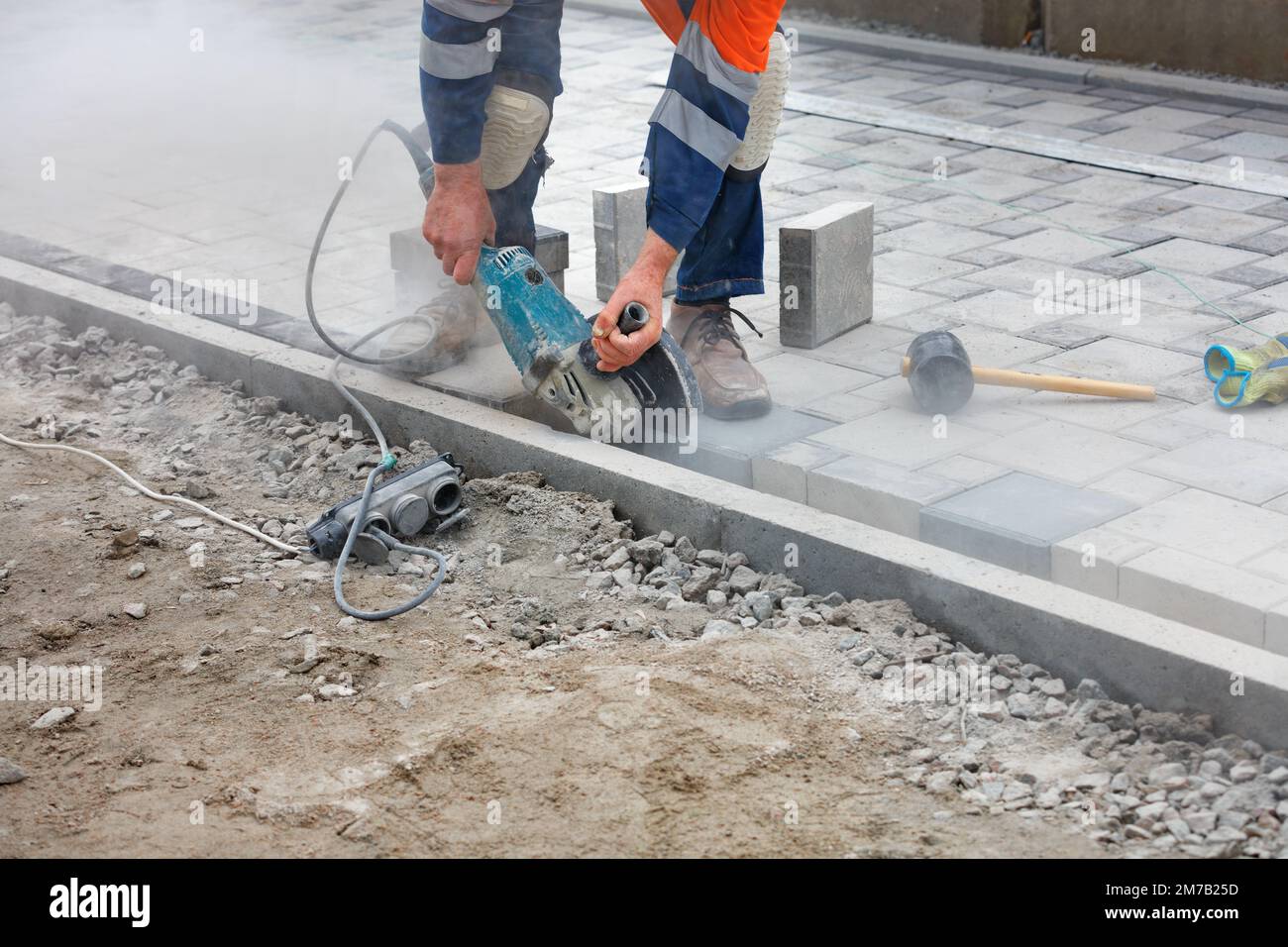 Construction worker laying paving hi-res stock photography and images ...