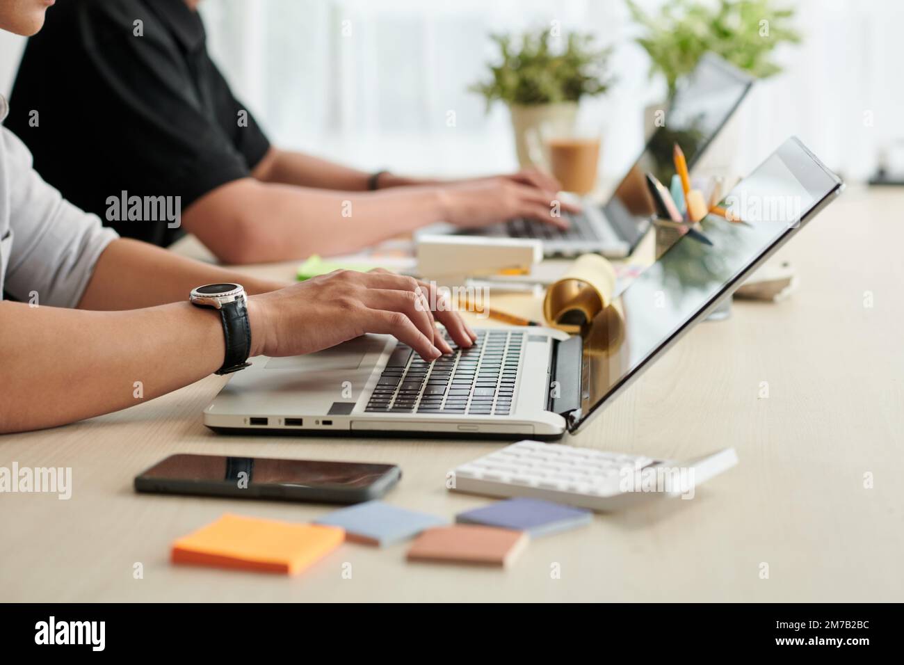 Office team hands typing laptops hi-res stock photography and images ...