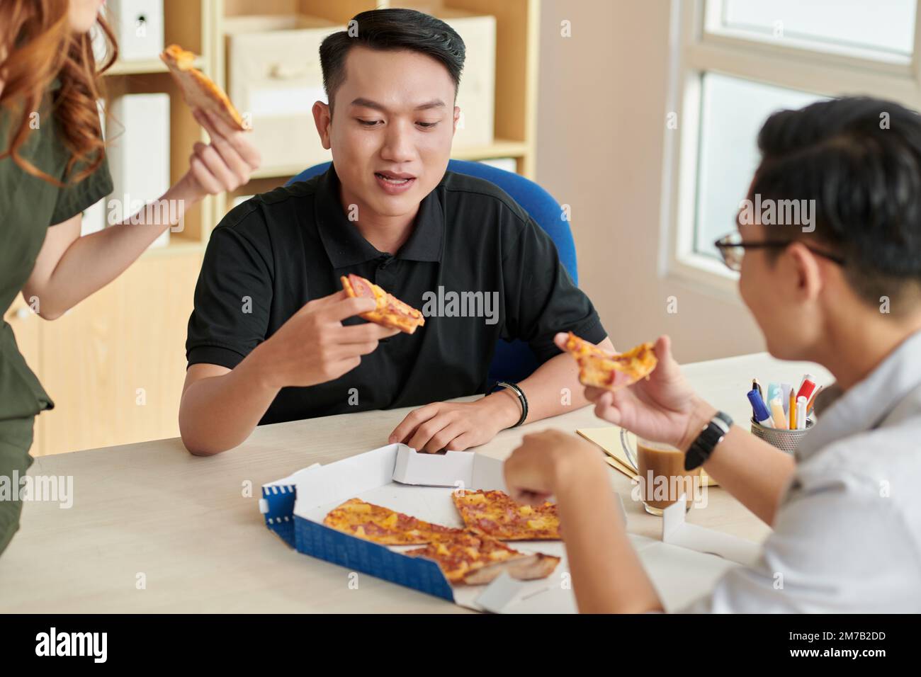 Businessman eating pizza desk hi-res stock photography and images - Alamy
