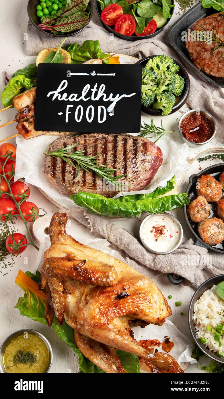 Various types of healthy cooked meat - beef, pork, chicken on a light ...