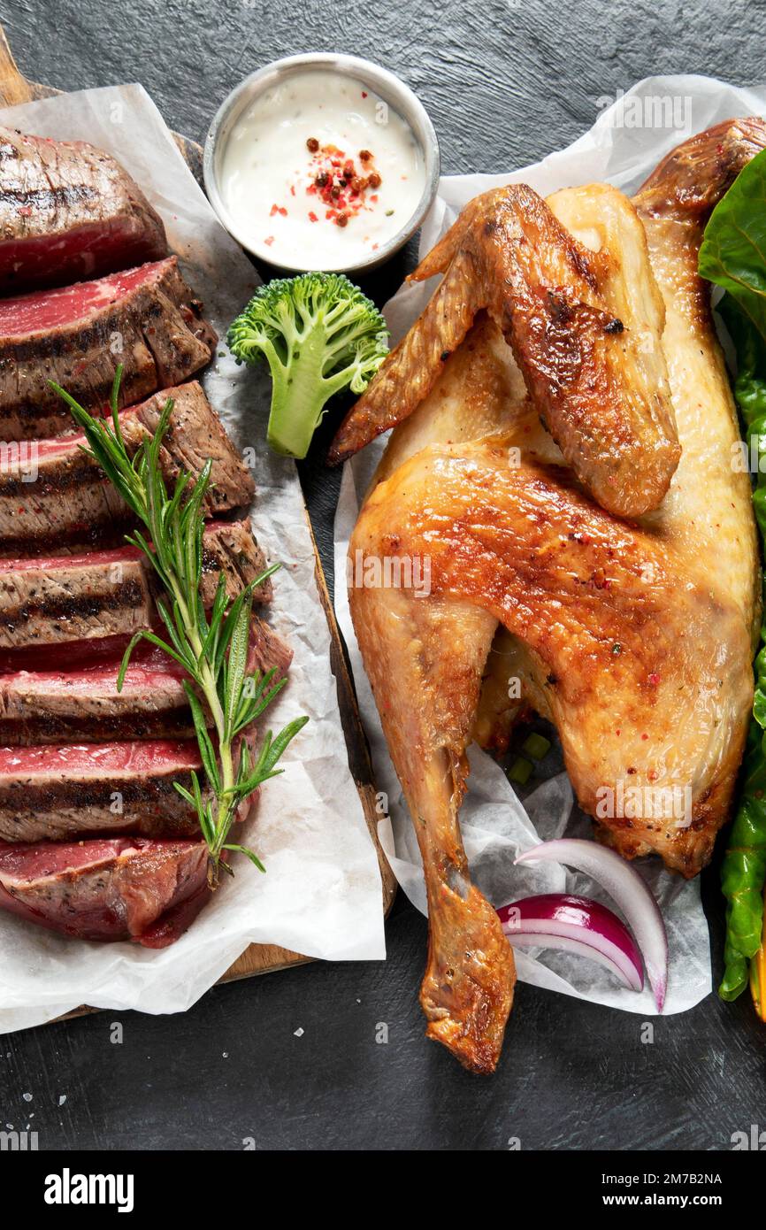 Various types of healthy cooked meat - beef, pork, chicken on a dark ...