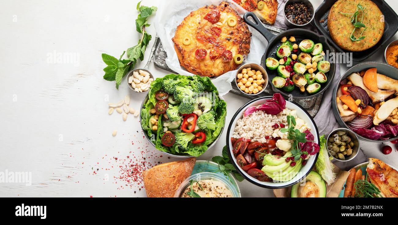 Vegetarian and various vegan dishes on grey table. Healthy food concept ...