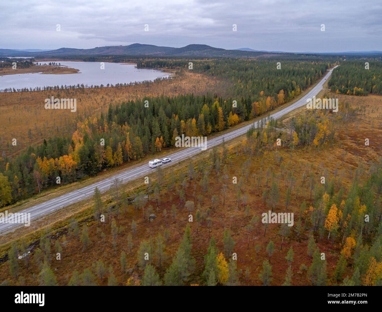 drone footgage Car Camping Caravan driving road lake Swedish Lapland ...