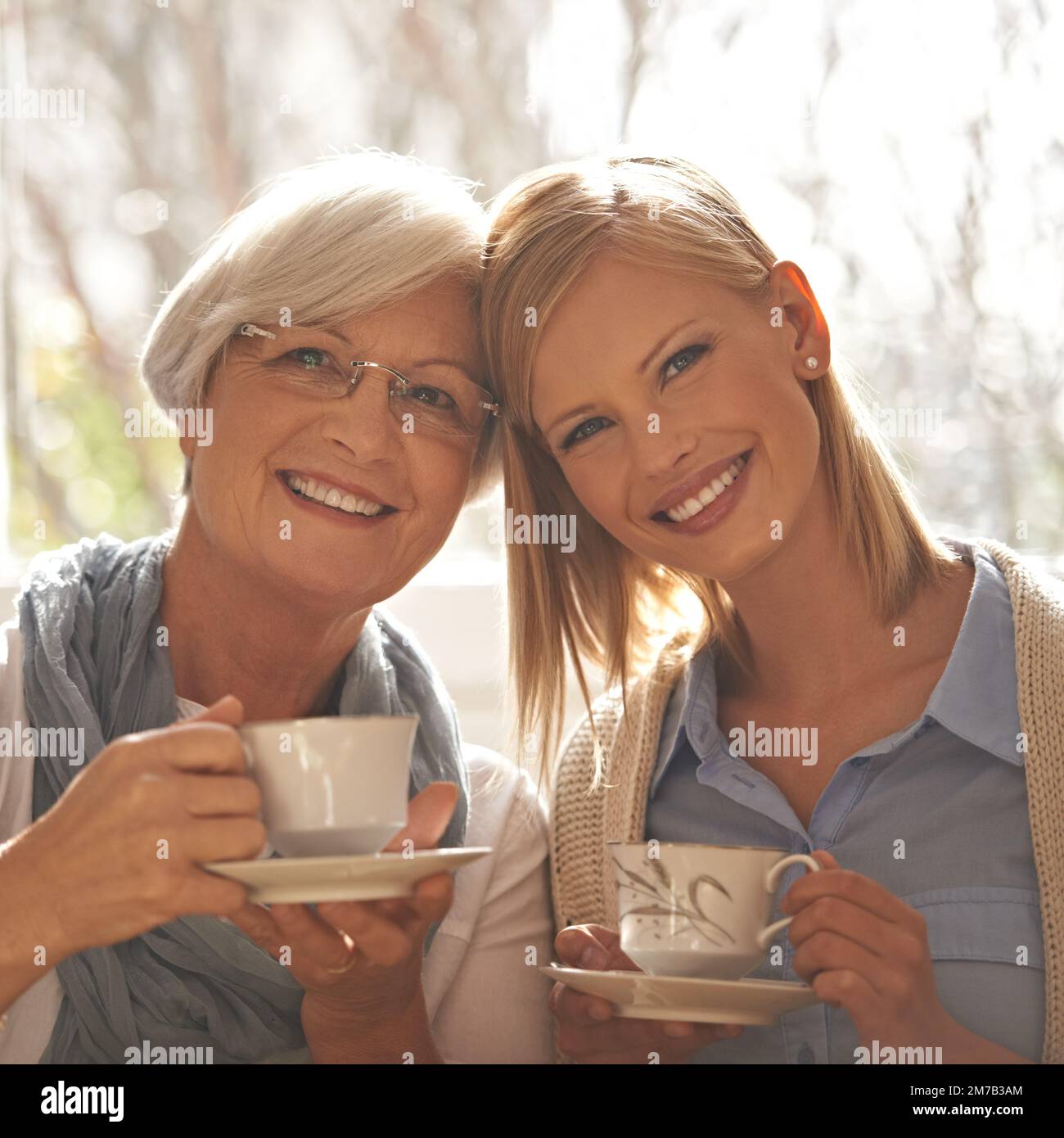 Two for tea. A portrait of a happy woman visiting her grandmother at her house Stock Photo - Alamy