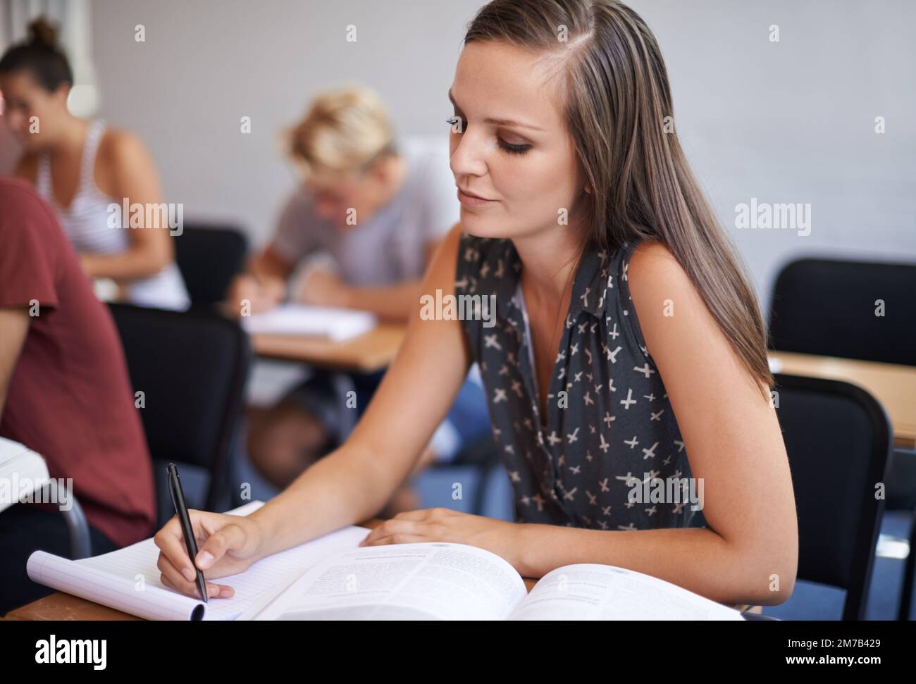 Making sure her research is quoted. An attractive young varsity student ...