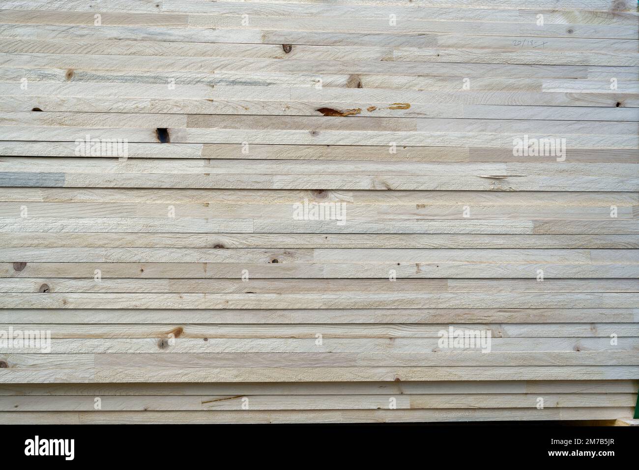 Stacked timber. Timbers ready for sale on the timber site. Withstanding ...