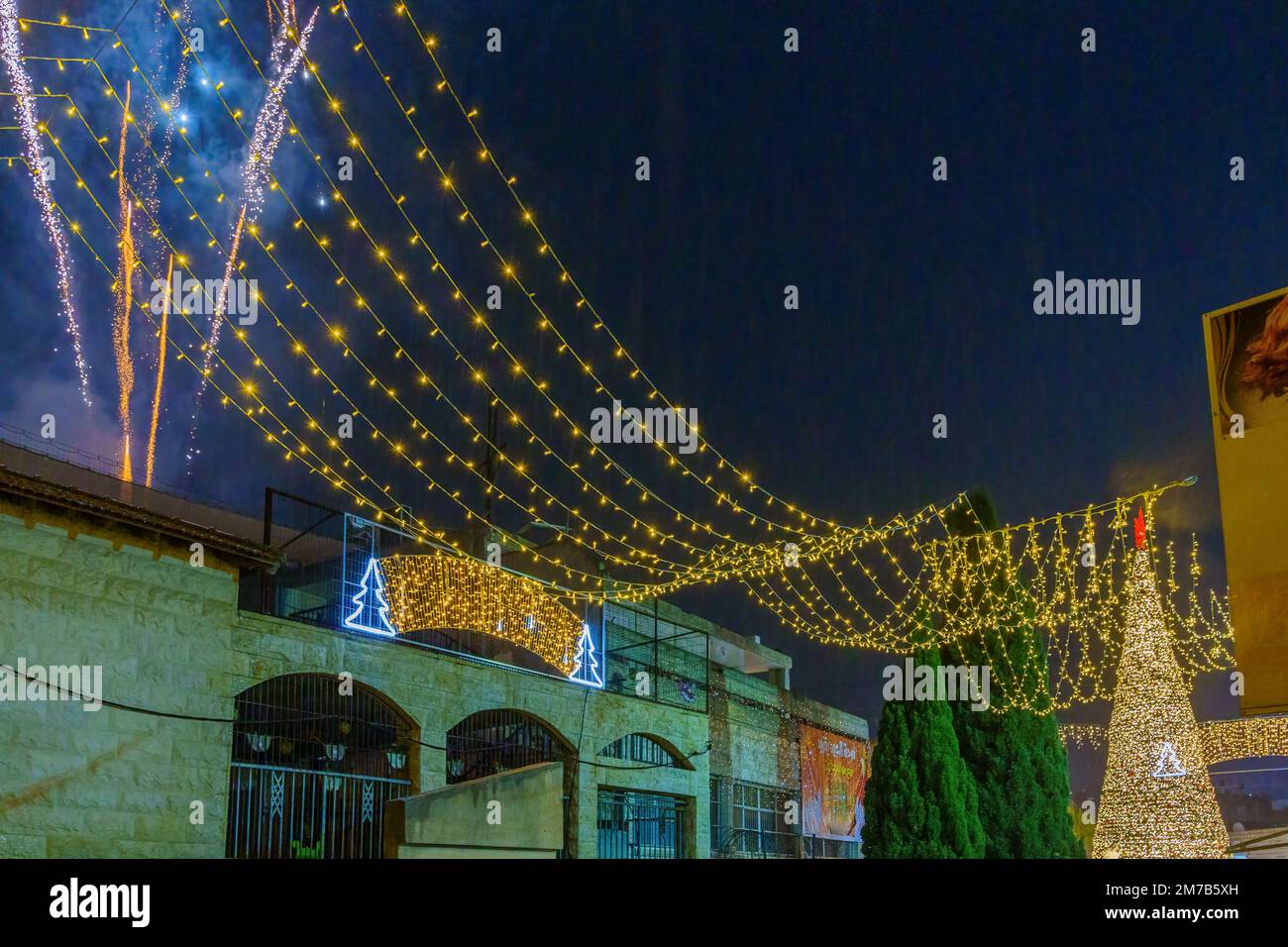 Nazareth, Israel - January 06, 2023: Fireworks and Christmas tree in ...