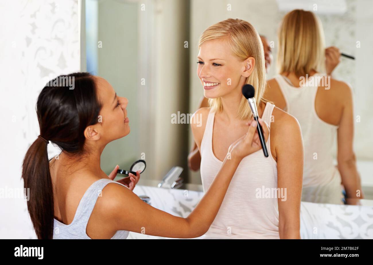 Beautiful woman doing makeup hi-res stock photography and images - Alamy