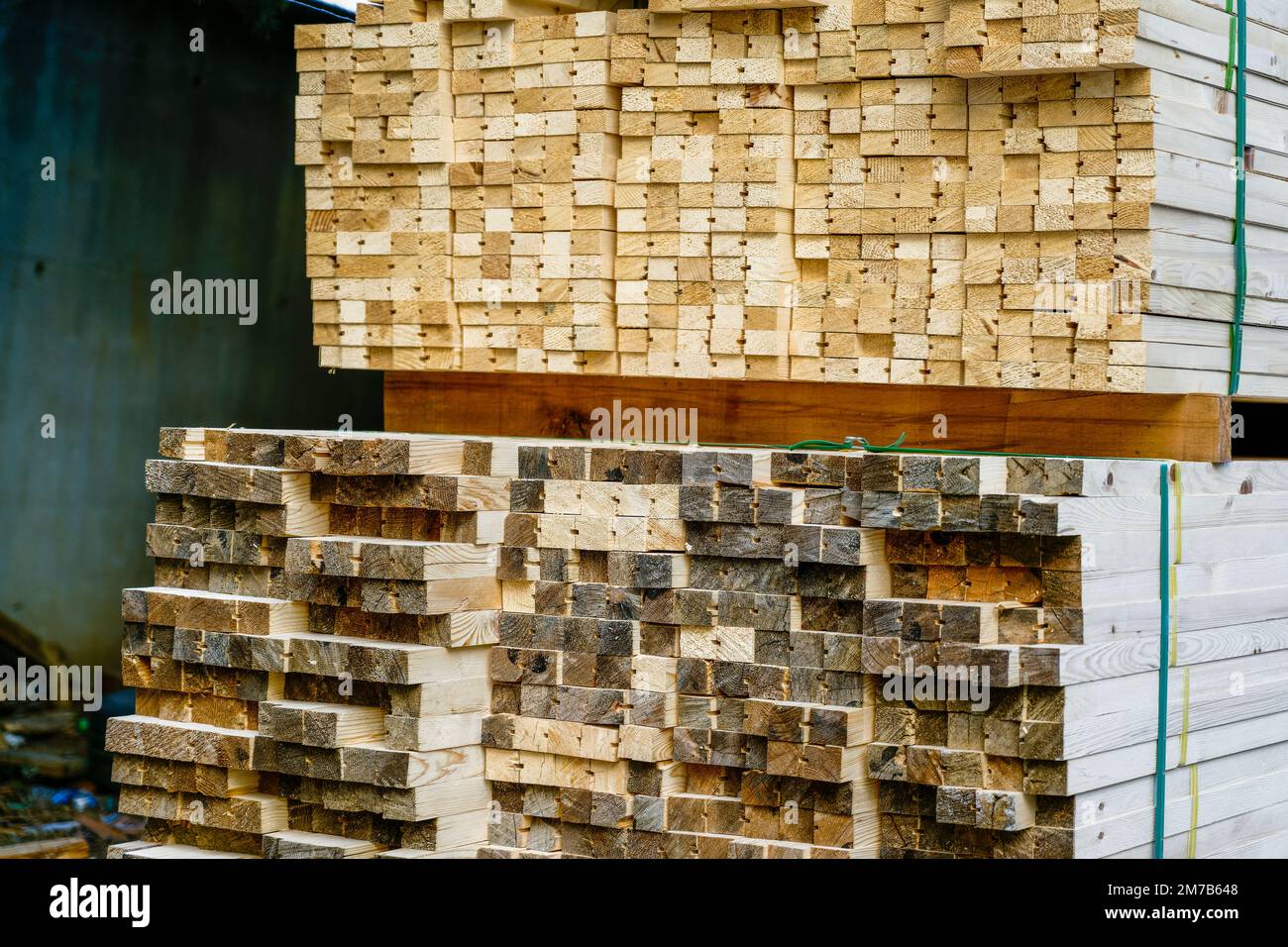 Stacked timber. Timbers ready for sale on the timber site. Withstanding ...