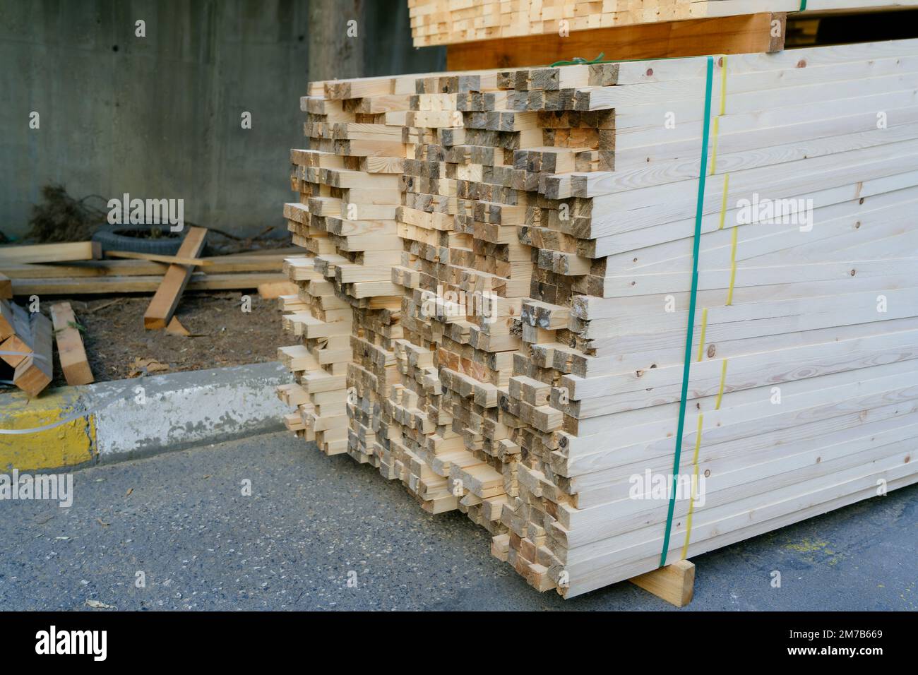Stacked timber. Timbers ready for sale on the timber site. Withstanding ...