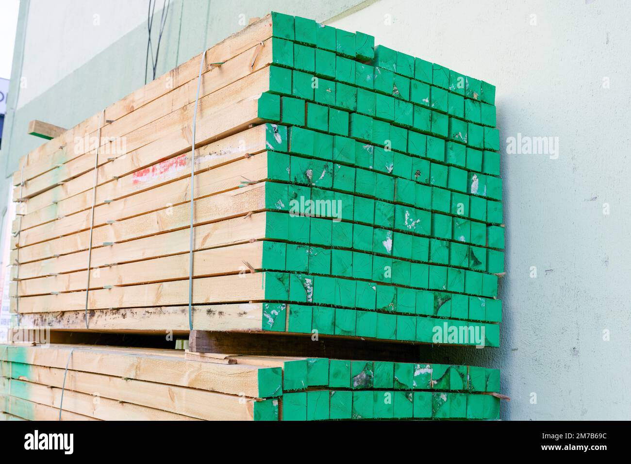Stacked timber. Timbers ready for sale on the timber site. Withstanding ...