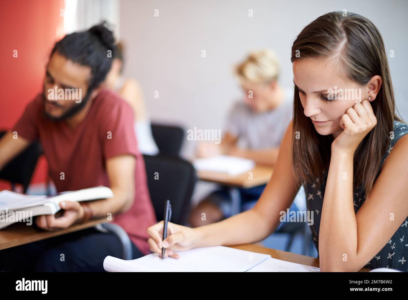Dedication to education. a group of university students studying ...