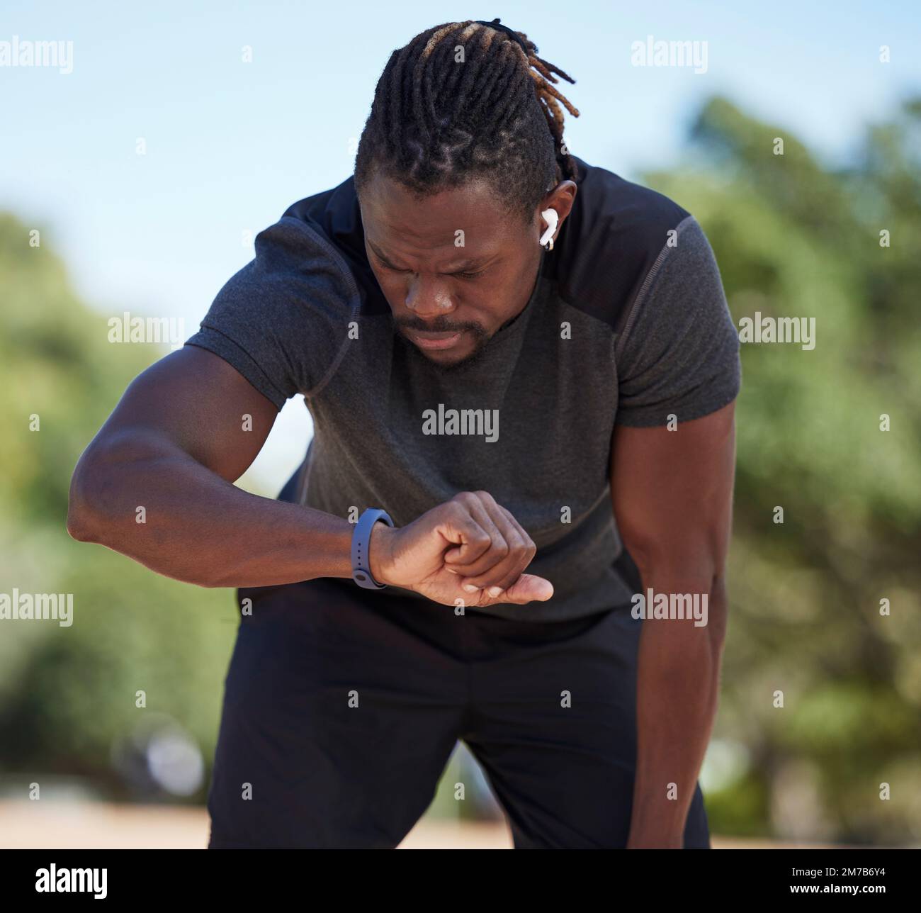 Fitness, black man and smart watch time for running exercise, workout ...