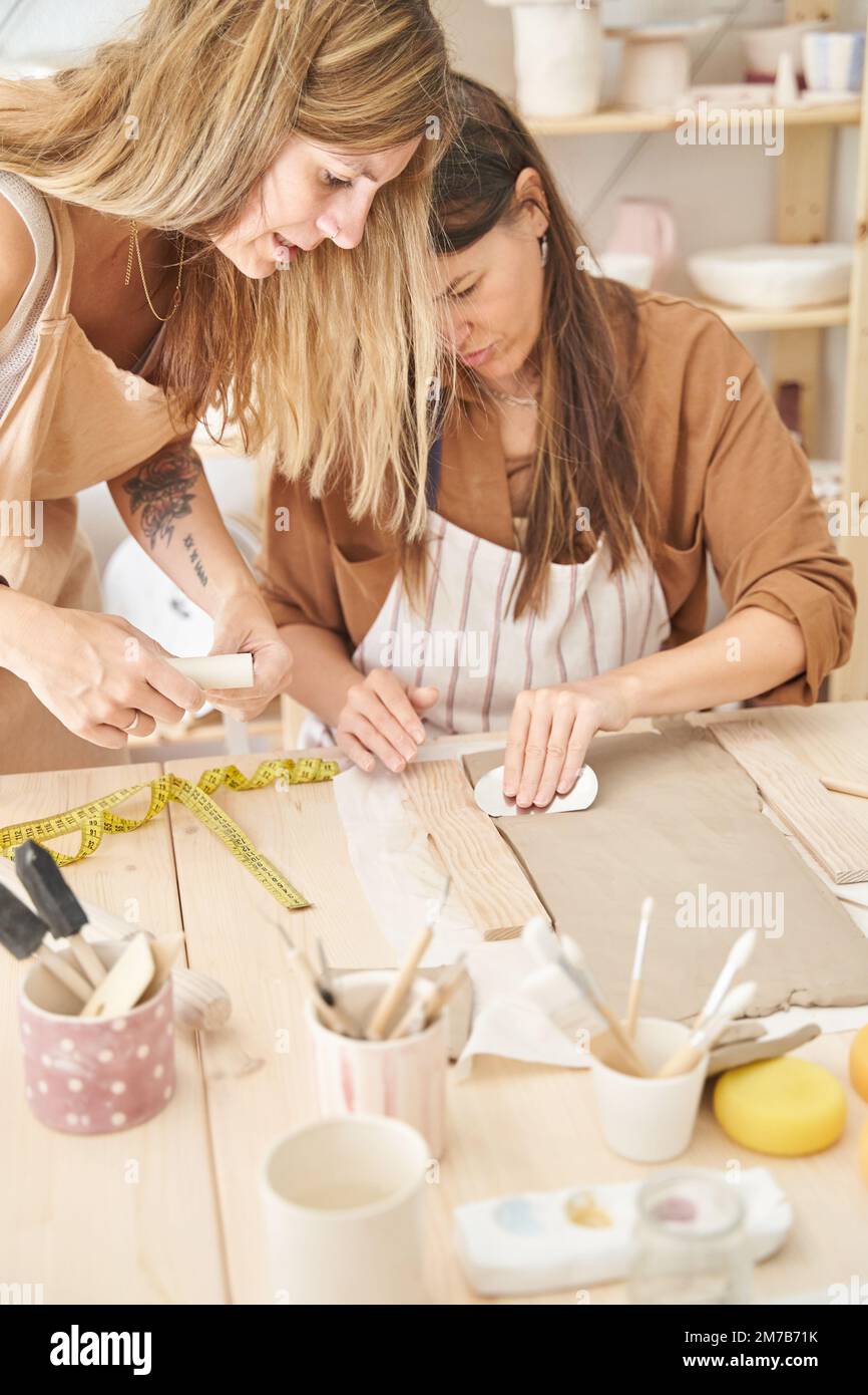 Friends aprons in pottery hi-res stock photography and images - Alamy