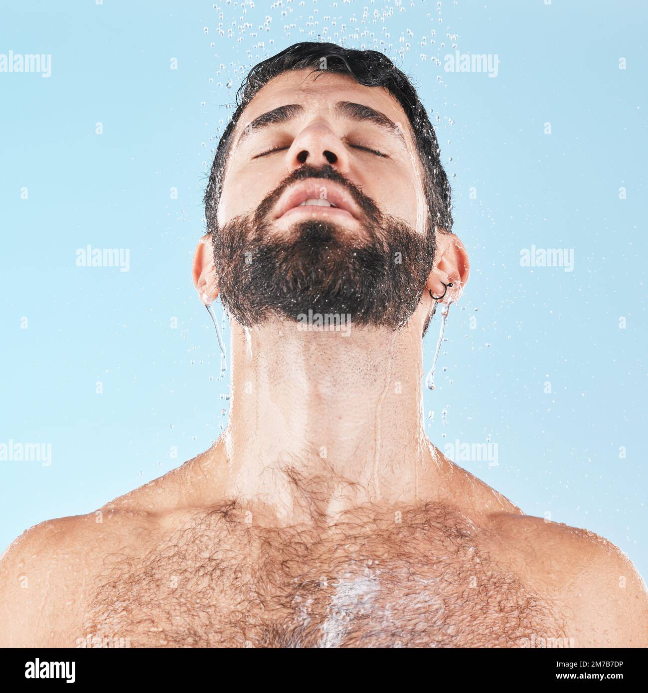 Man in shower, water and clean body with hygiene, grooming and skincare ...