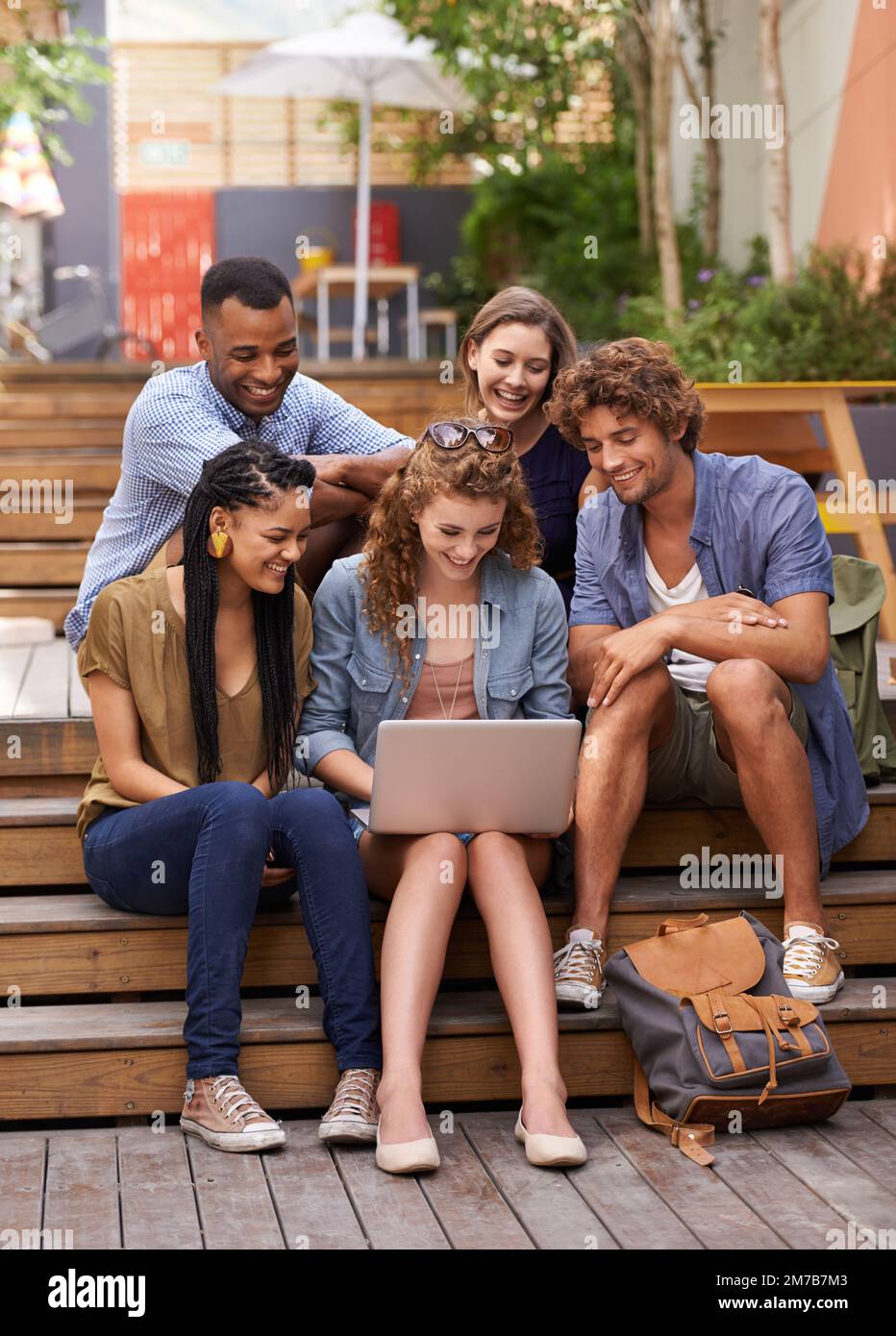 Lets take this lesson online. A group of students gathered around a ...