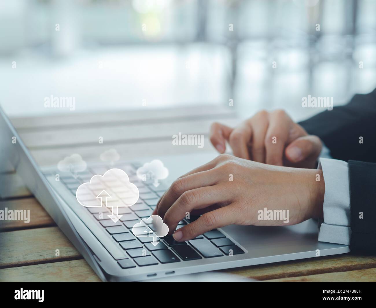 Cloud technology concept. Small cloud icons appearing on laptop ...