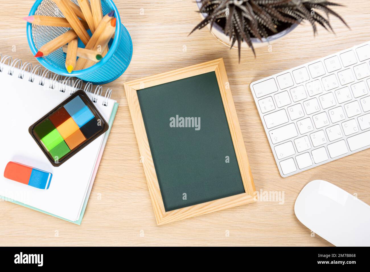 School chalkboard mockup on work desk. Composition of a student's desk ...