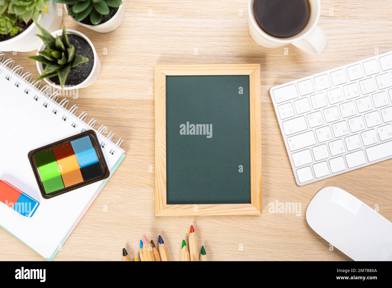 School chalkboard mockup on work desk. Composition of a student's desk ...