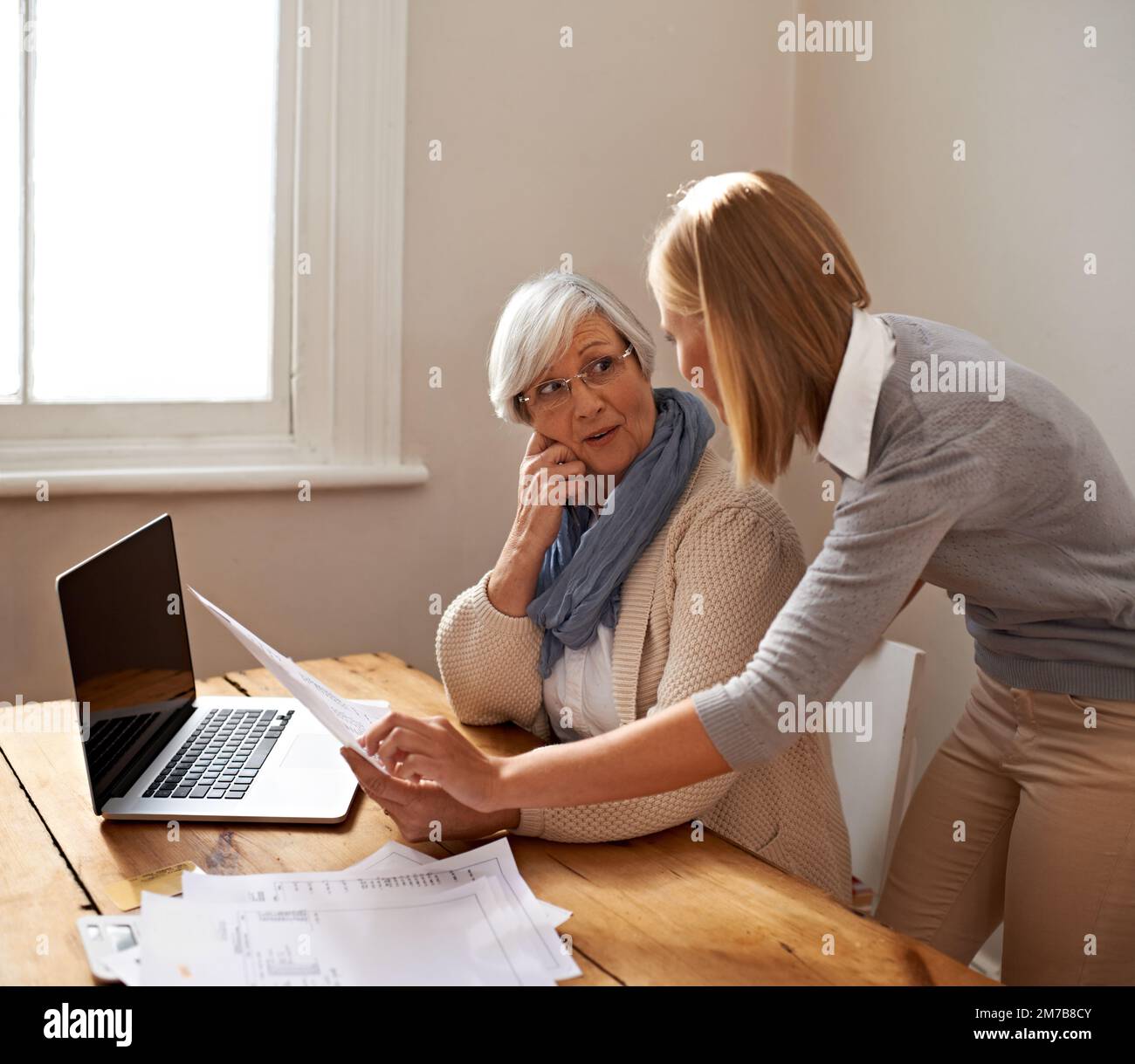 Giving her grandmother some much needed assistance. Cropped view of a ...