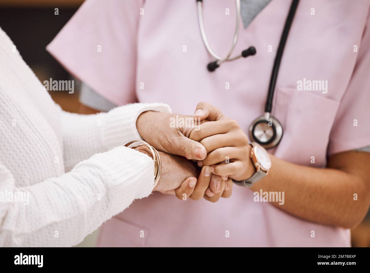 Support, empathy and nurse holding hands with patient for compassion, trust and comfort from ...