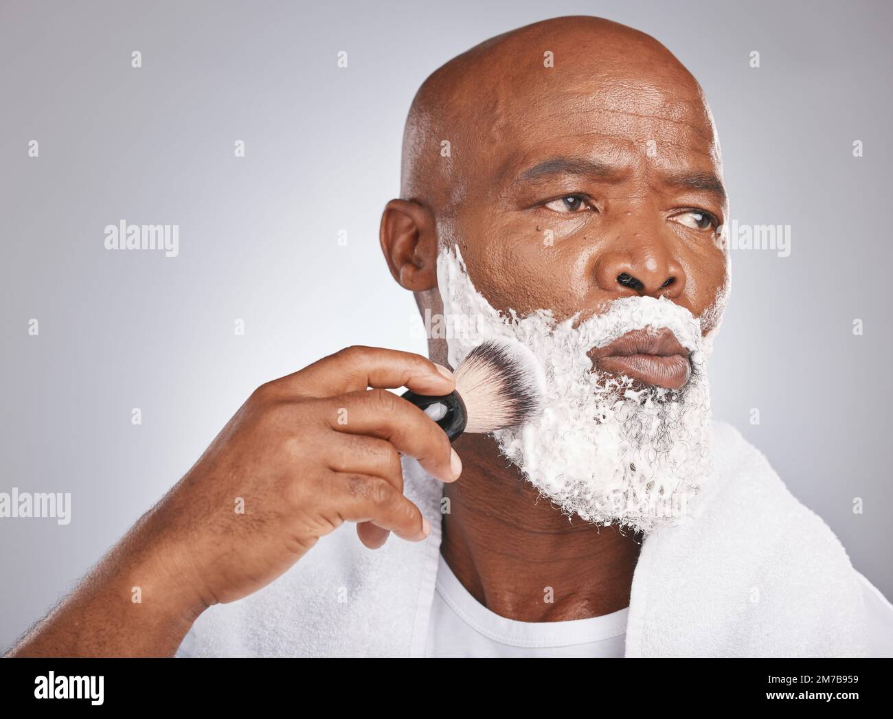 Face, shaving cream and black man with brush on beard, skincare spa ...