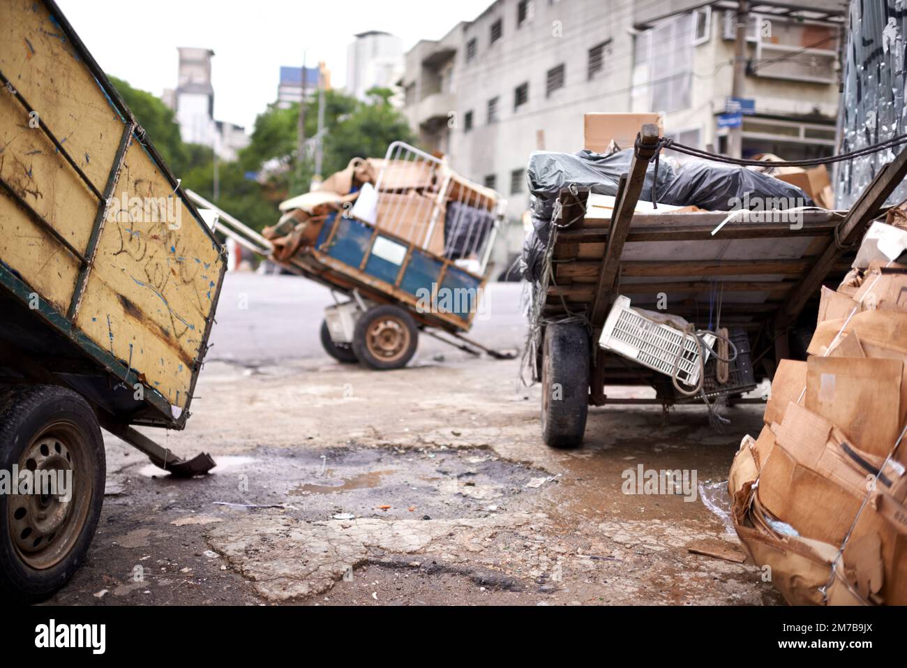 Garbage collection. carts full of garbage in the street of a poverty ...
