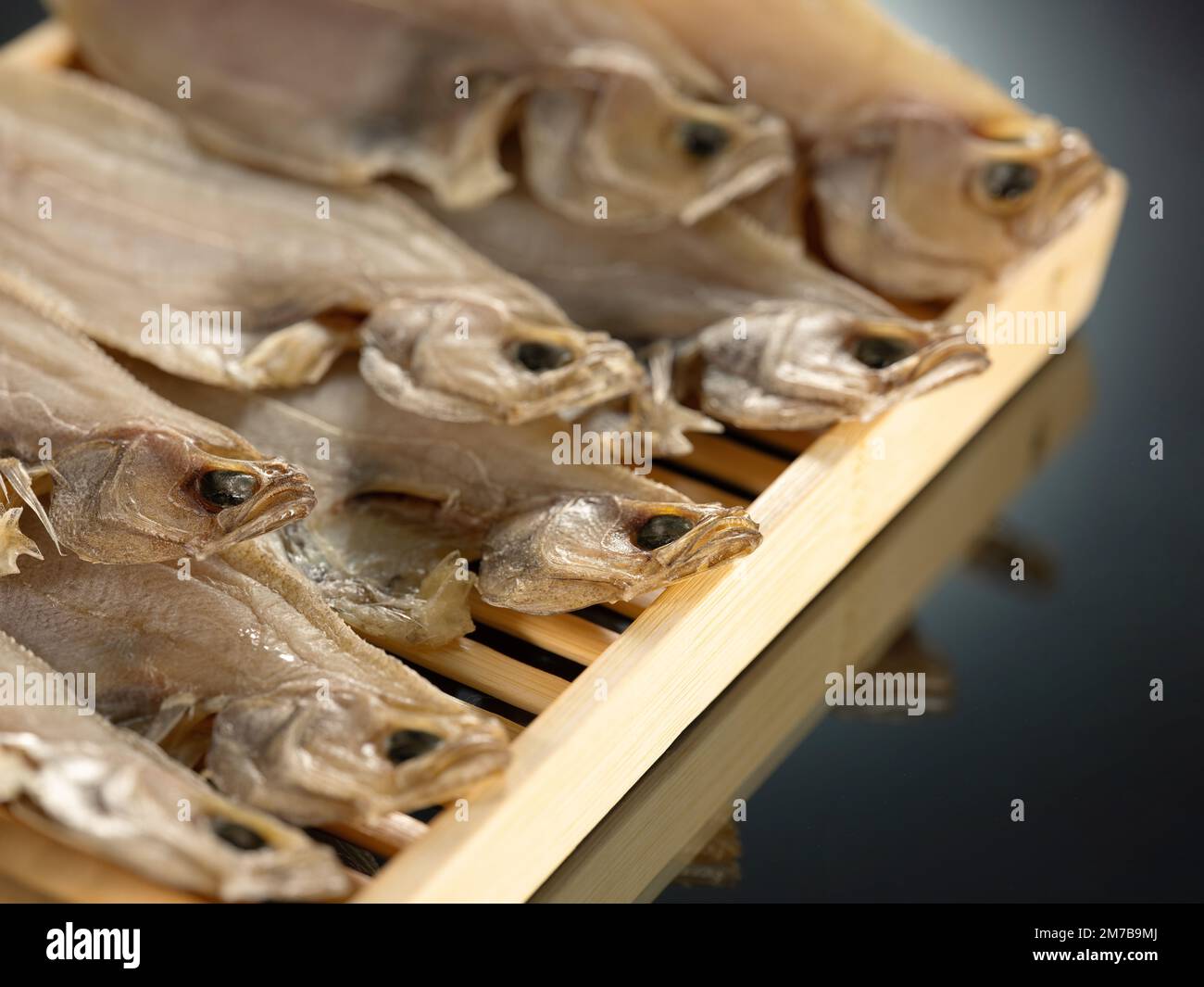 Dried flounder on a bamboo plate Stock Photo - Alamy