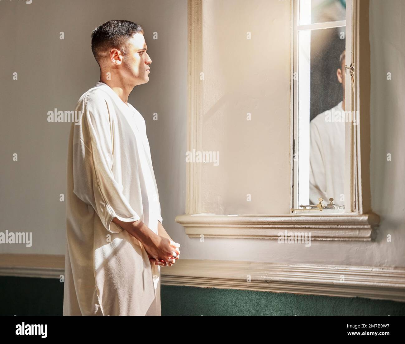 Prayer, reflection and muslim man in mosque with mirror in Saudi Arabia ...