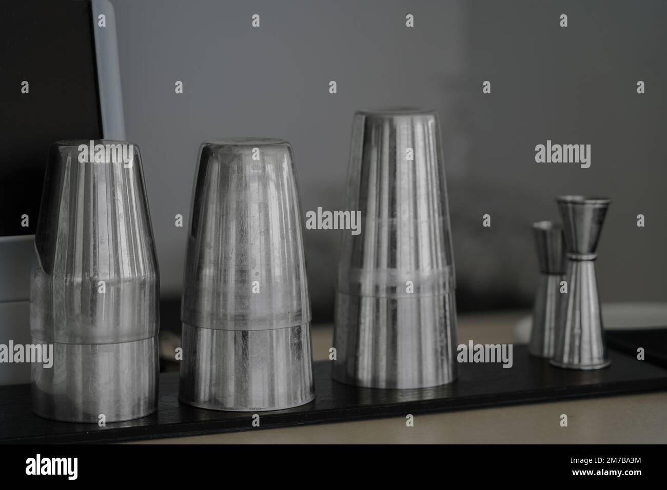 A closeup of rinsed mixing cups on a bar counter for cocktails Stock ...