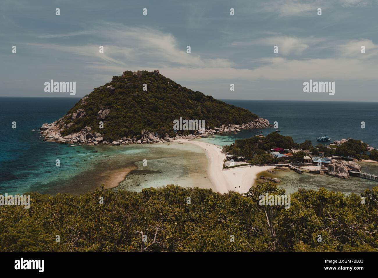 A Koh Tai paradise island covered with trees surrounded by a sea ...