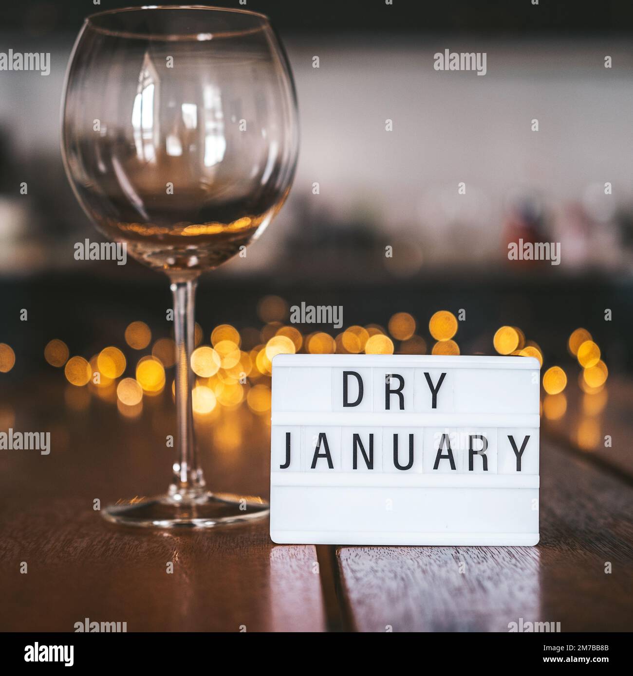 Challenge dry January. Wine glass with water. Non-alcoholic month Stock ...