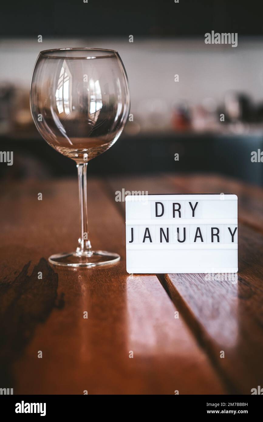 Challenge dry January. Wine glass with water. Non-alcoholic month Stock ...
