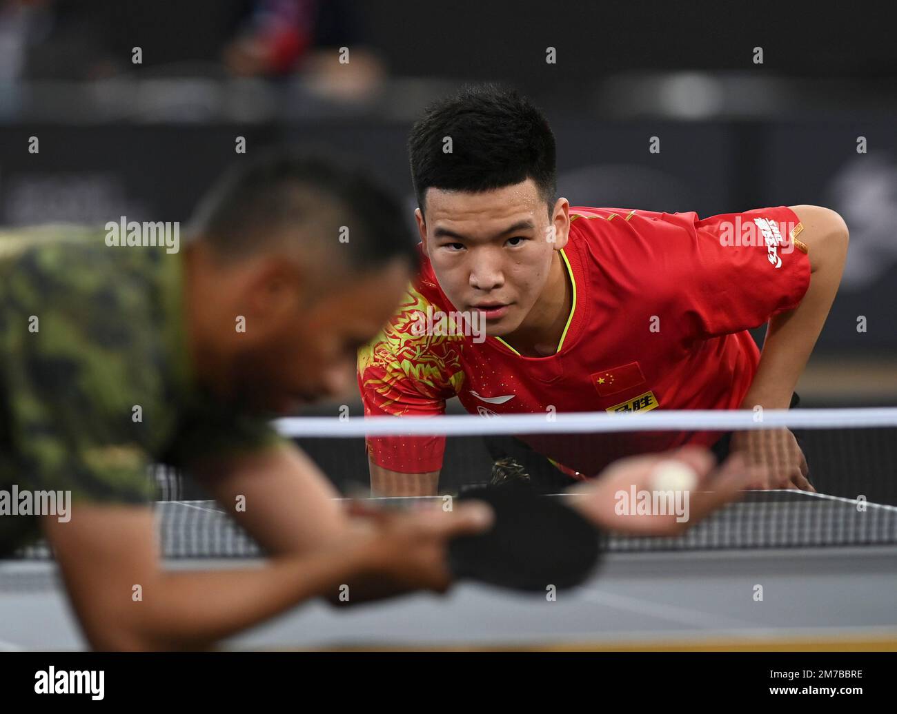 Doha, Qatar. 8th Jan, 2023. Xiang Peng of China competes against Ahmad ...
