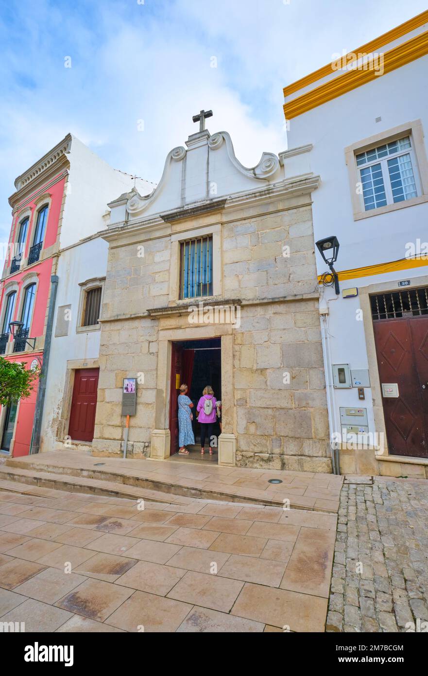 The exterior, front facade view of the stone entrance. At the Ermida de ...