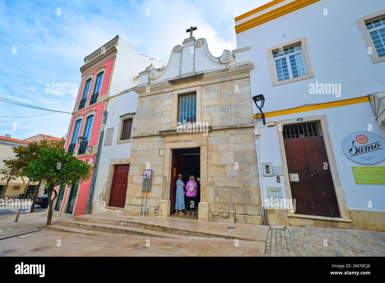The exterior, front facade view of the stone entrance. At the Ermida de ...