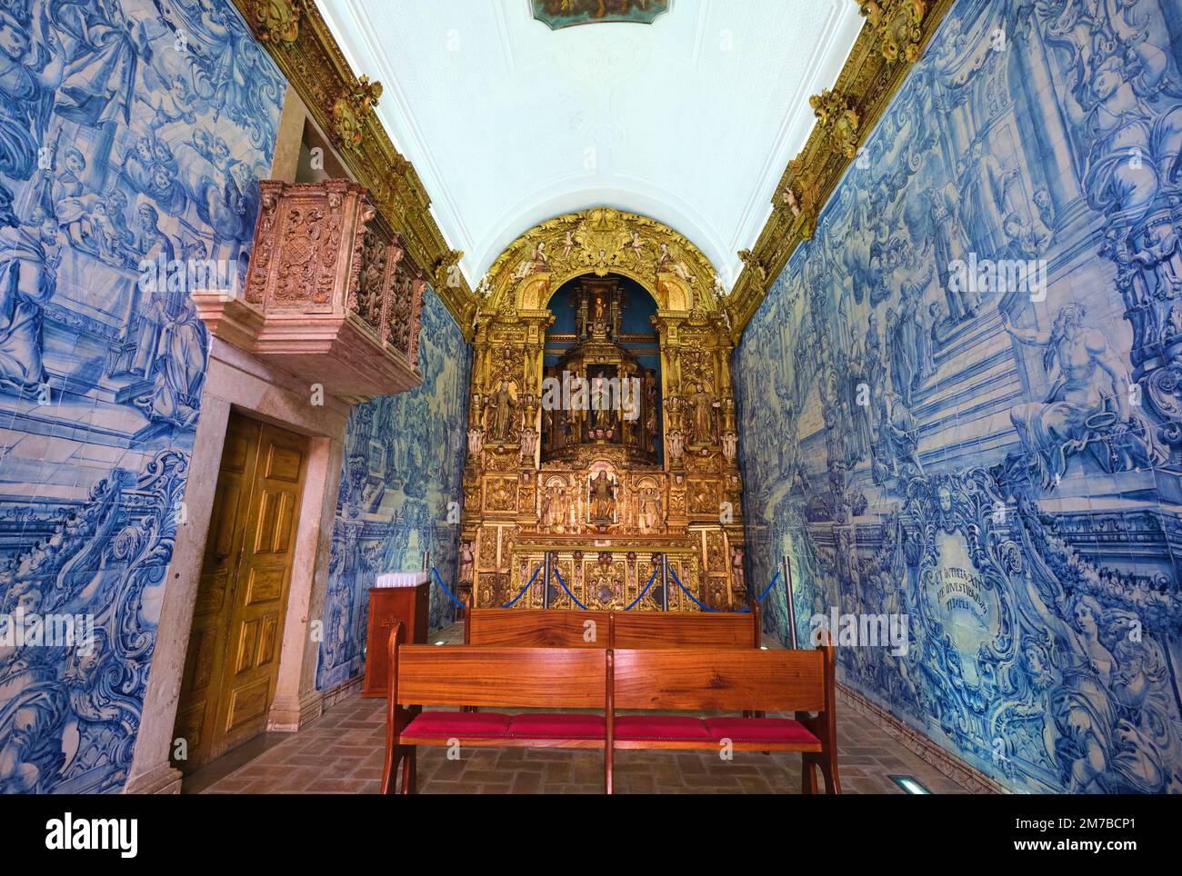 Interior view of the small chapel, with richly carved, gold, wood altar ...