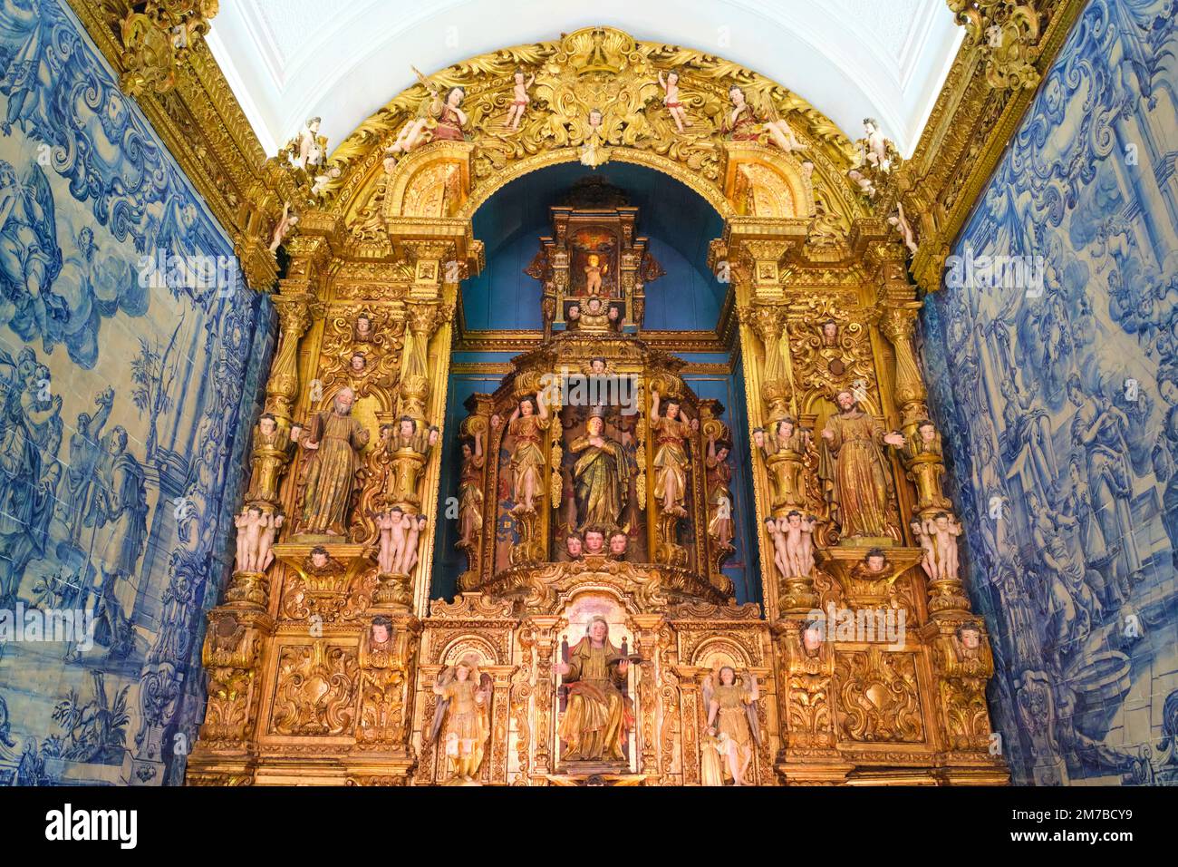 Interior view of the small chapel, with richly carved, gold, wood altar ...