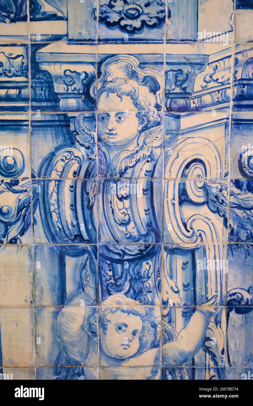 An angel cherub, baby head. A detail of the famous, iconic Azulejo ...