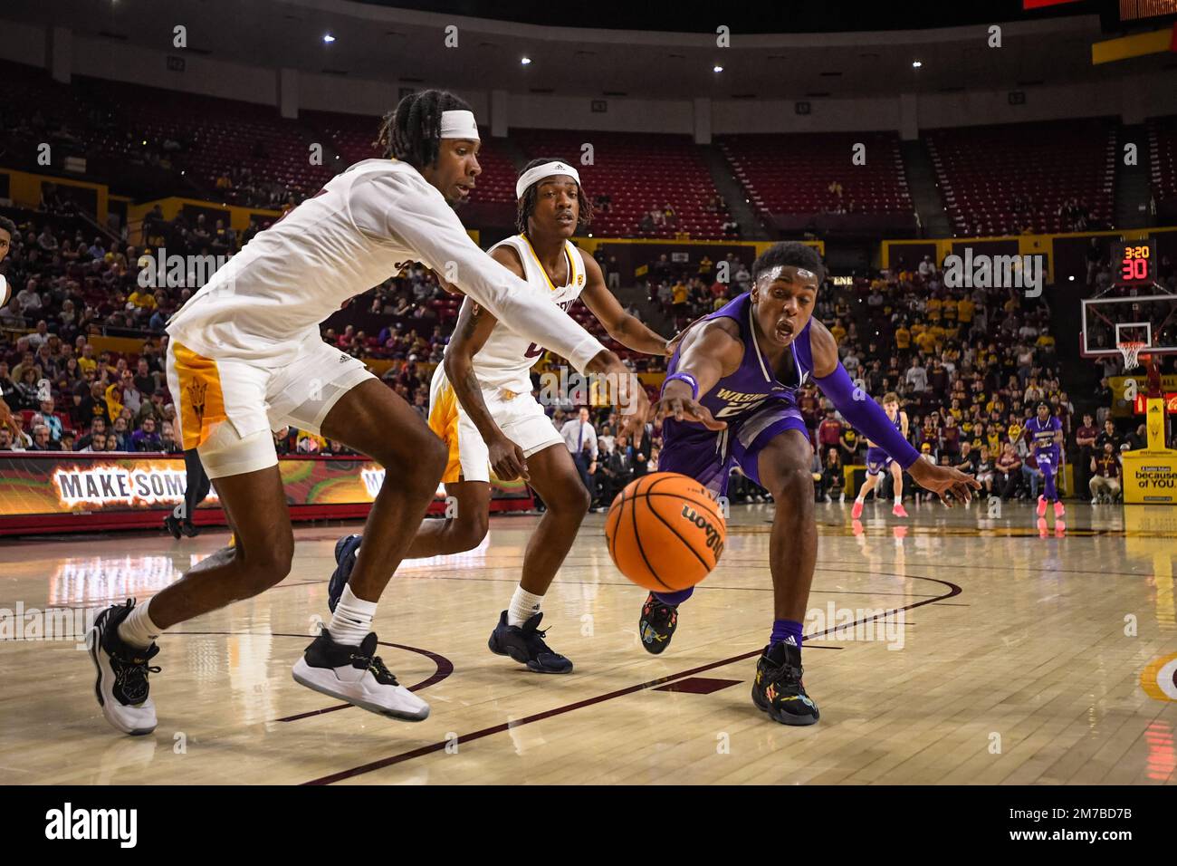 Arizona State guard Jamiya Neal (5) and Washington guard Noah Williams ...